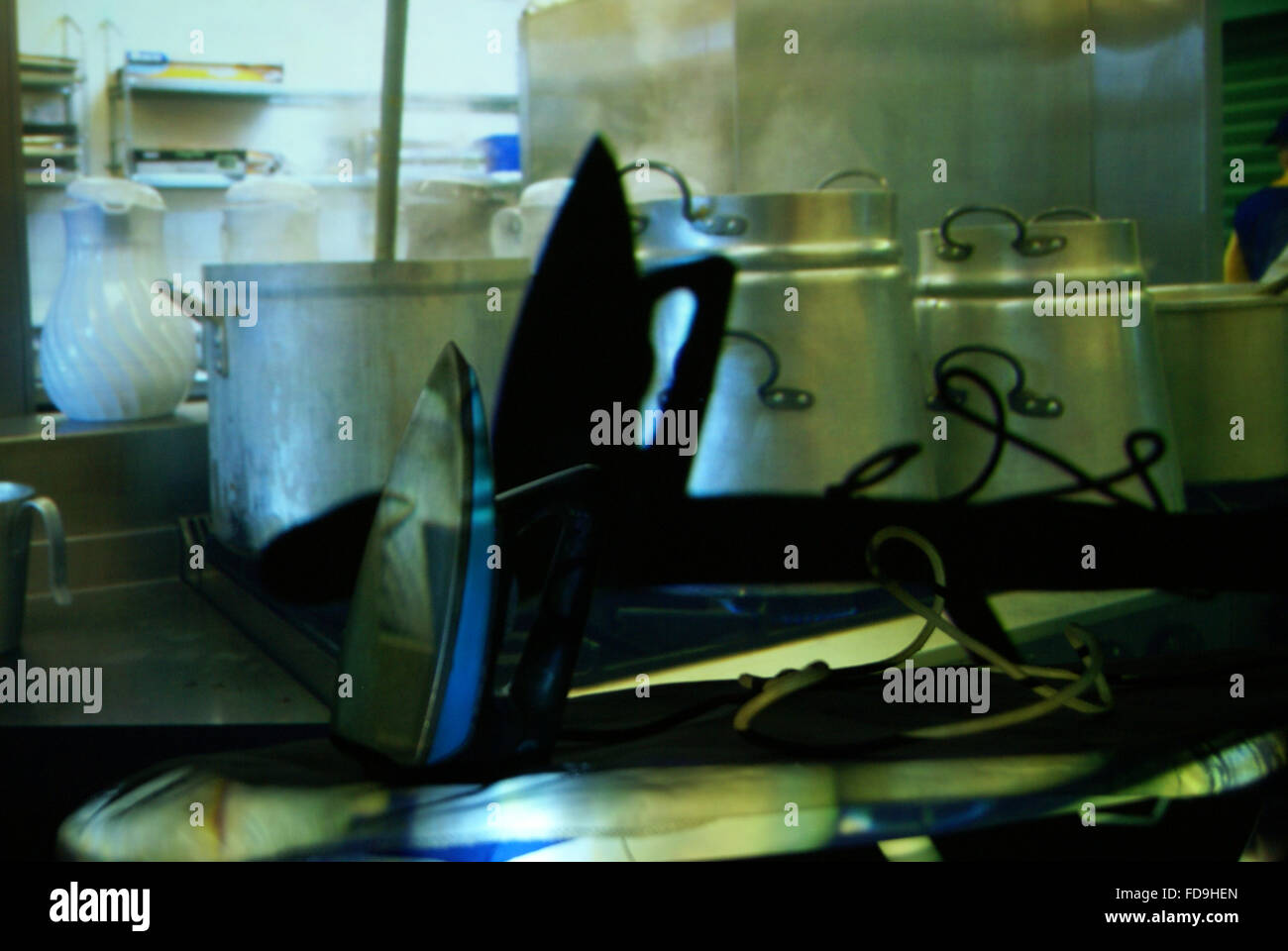 Iron with projected image of cooking Stock Photo - Alamy