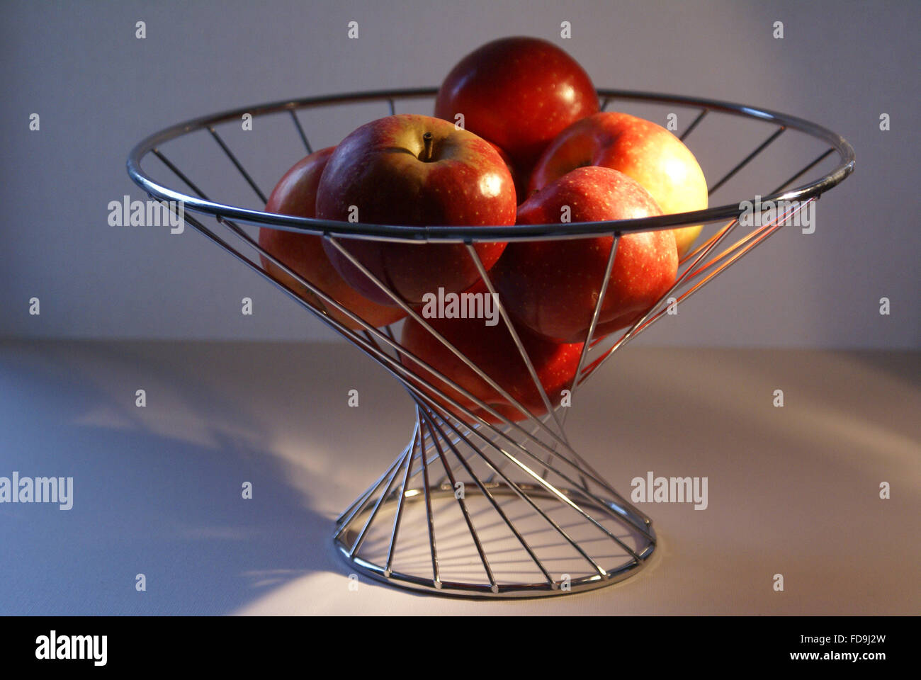 apples on display in wire fruit cage Stock Photo - Alamy