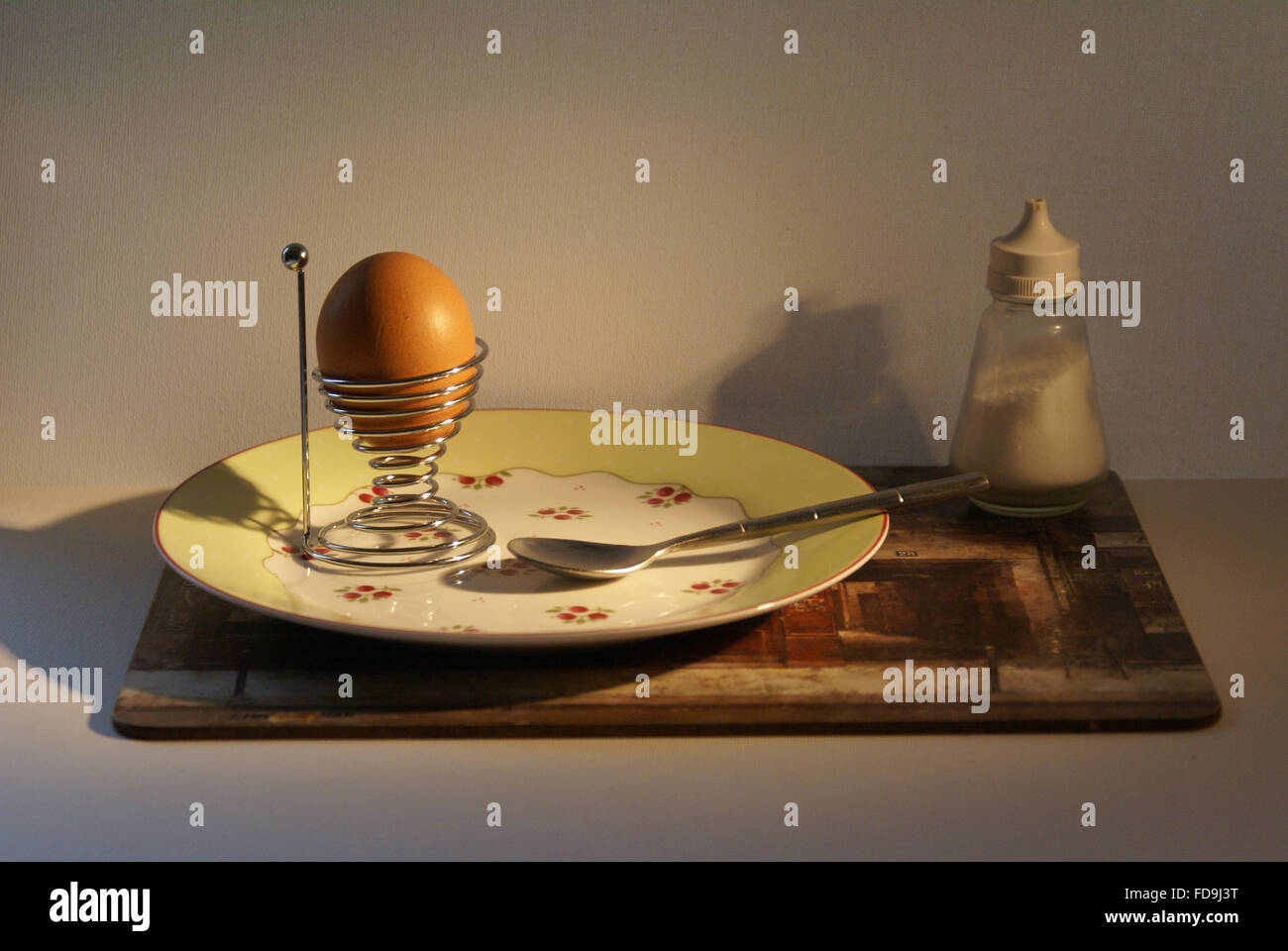 Egg and spoon still life shadows Stock Photo - Alamy