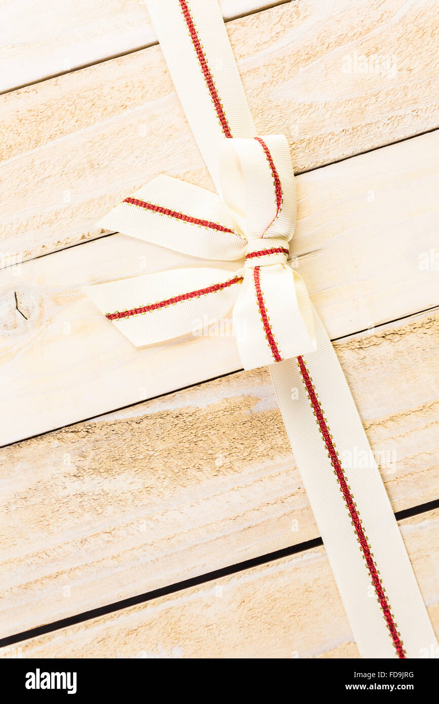 Classic bow made of wide white ribbon Stock Photo - Alamy