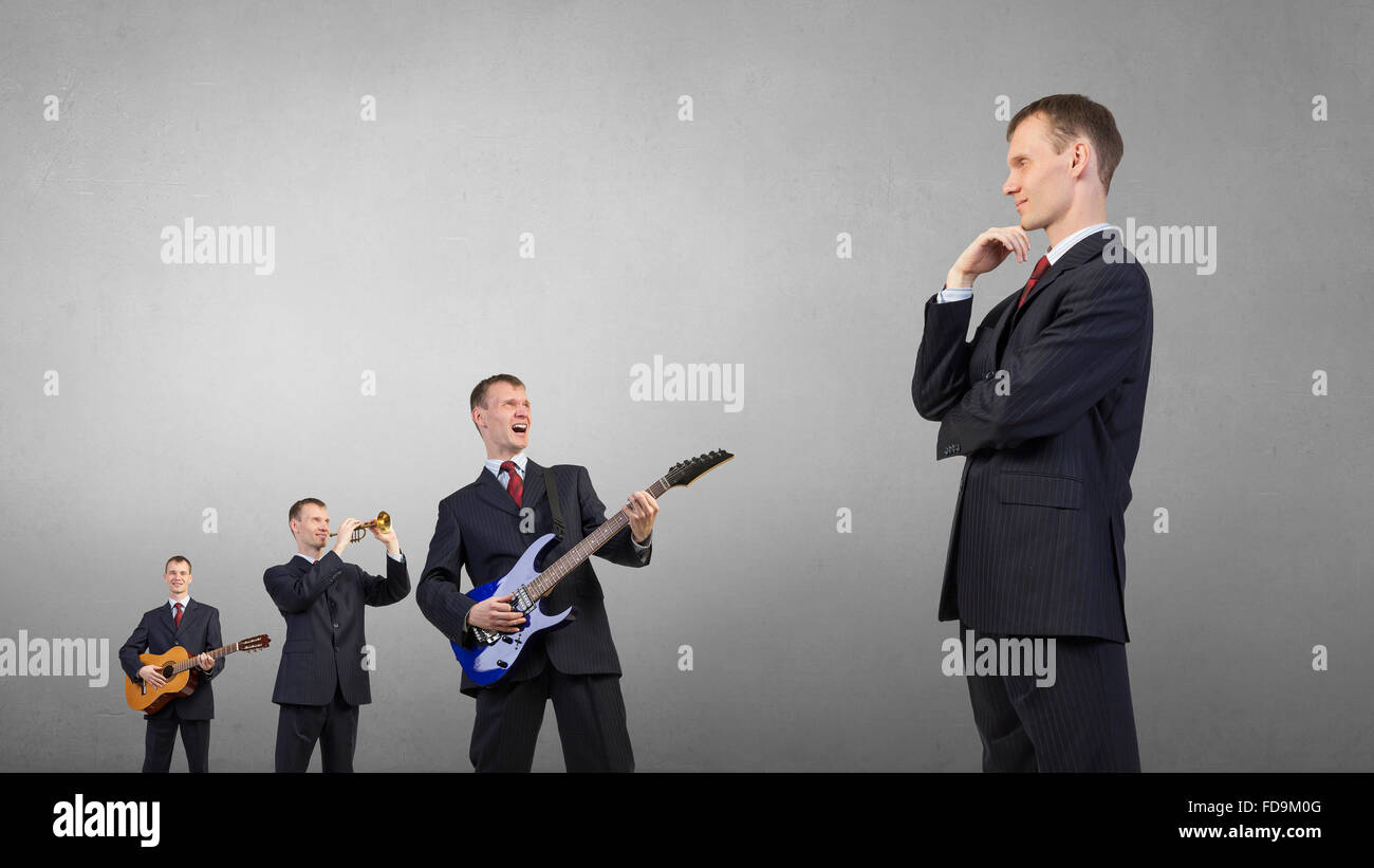 Young man in suit and people playing different music instruments Stock ...