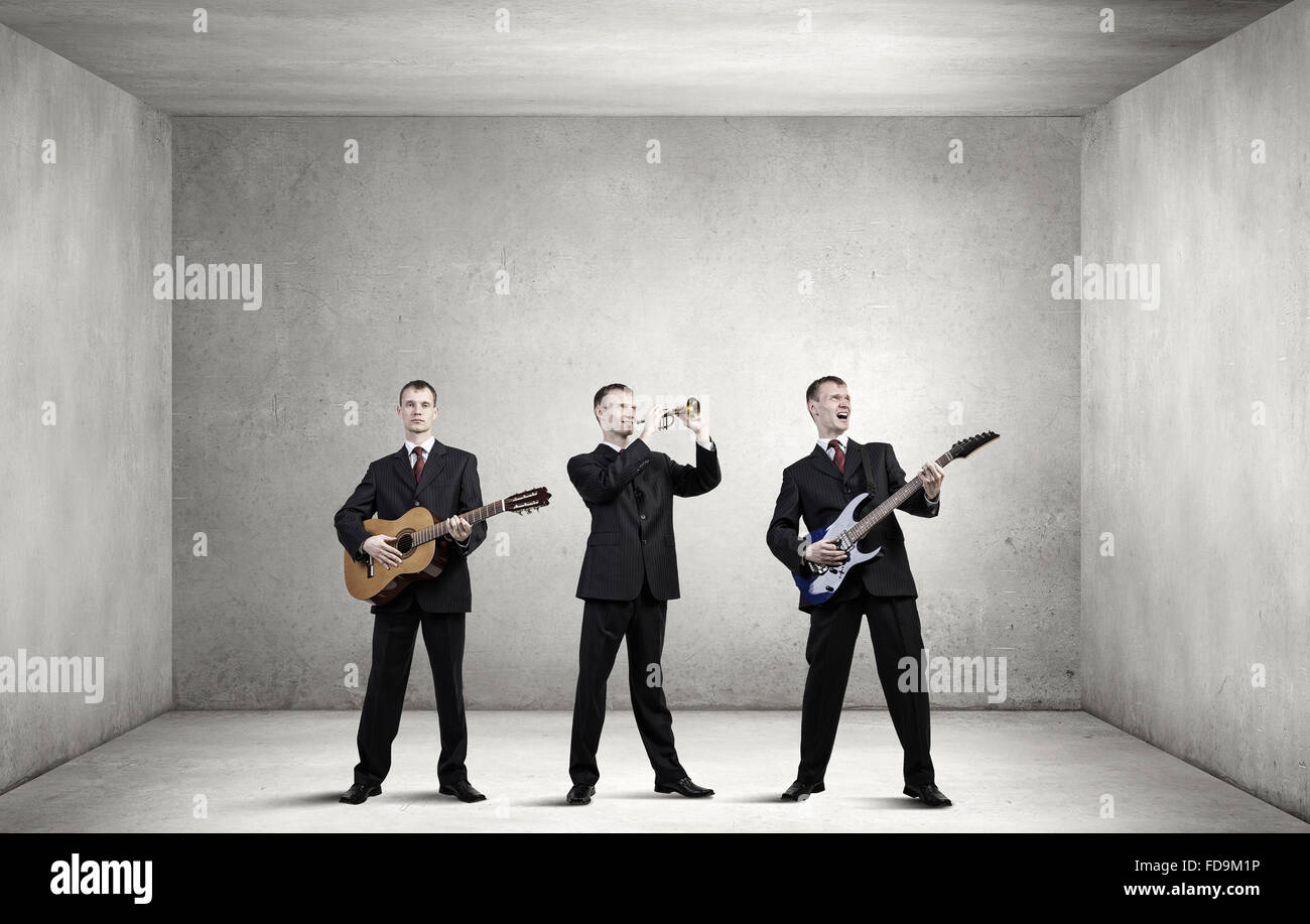Young man in suit and people playing different music instruments Stock ...