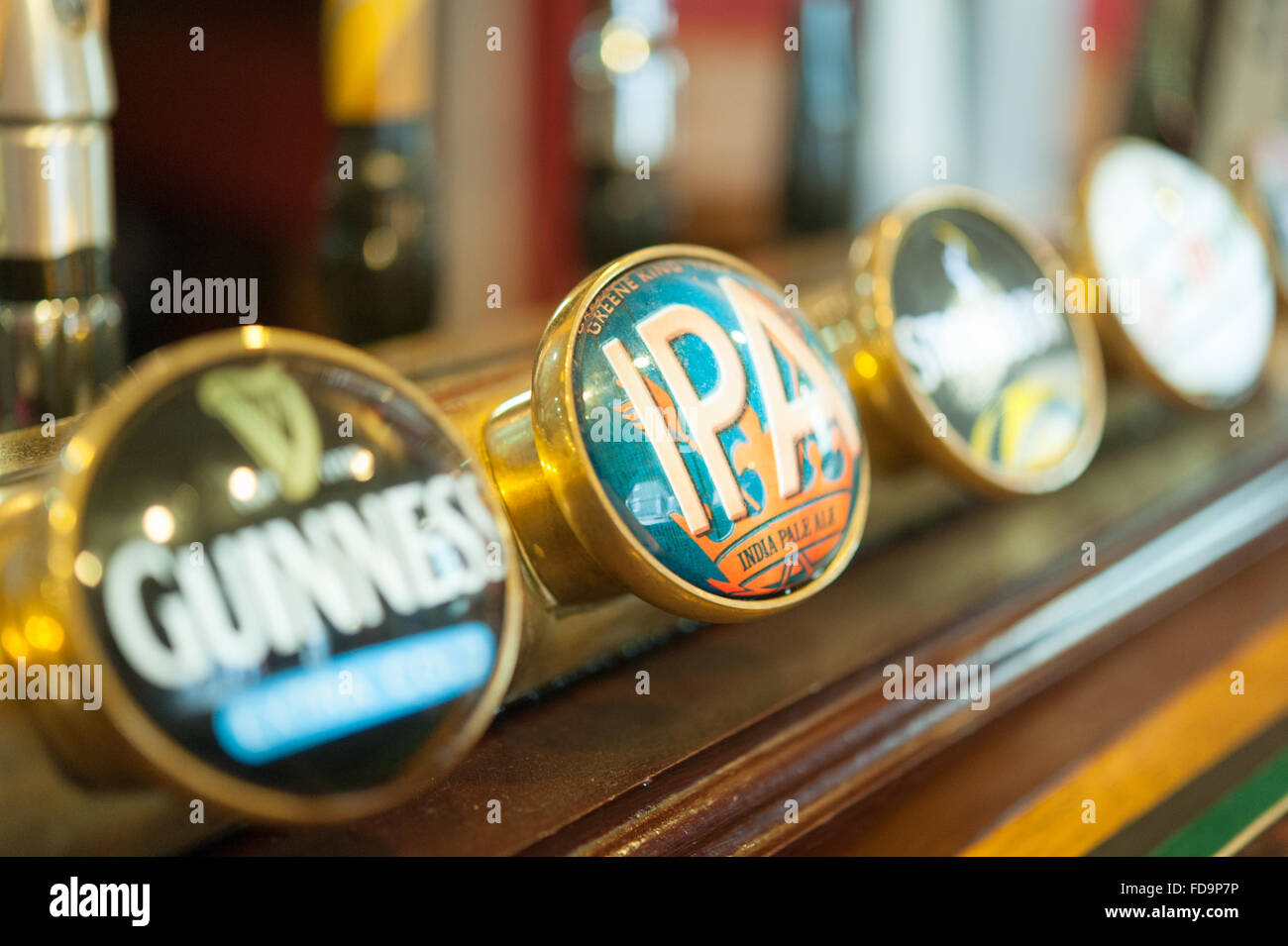 Beer handpumps in the interior of a traditional English pub Stock Photo ...