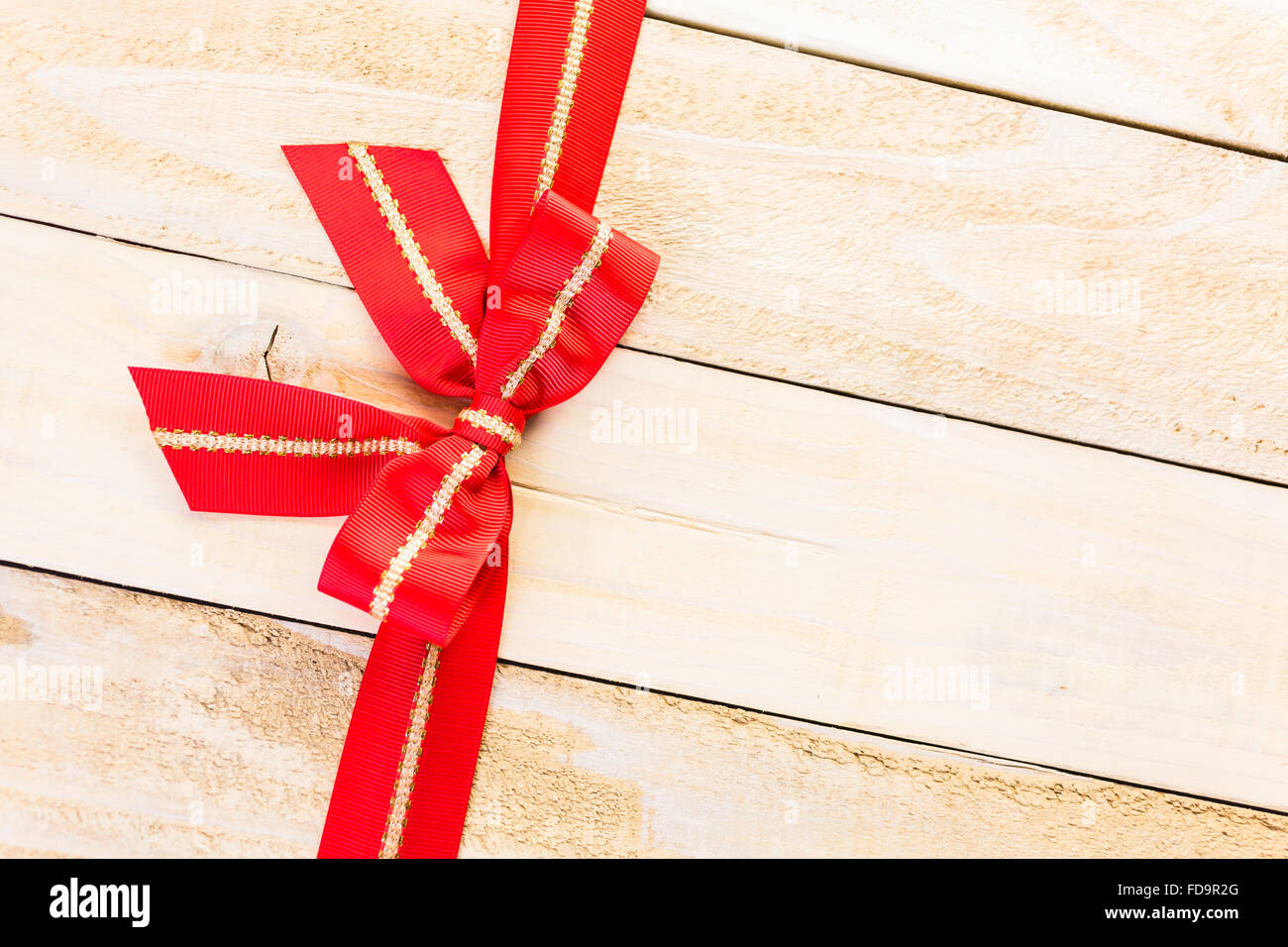 Classic bow made of wide red ribbon Stock Photo - Alamy