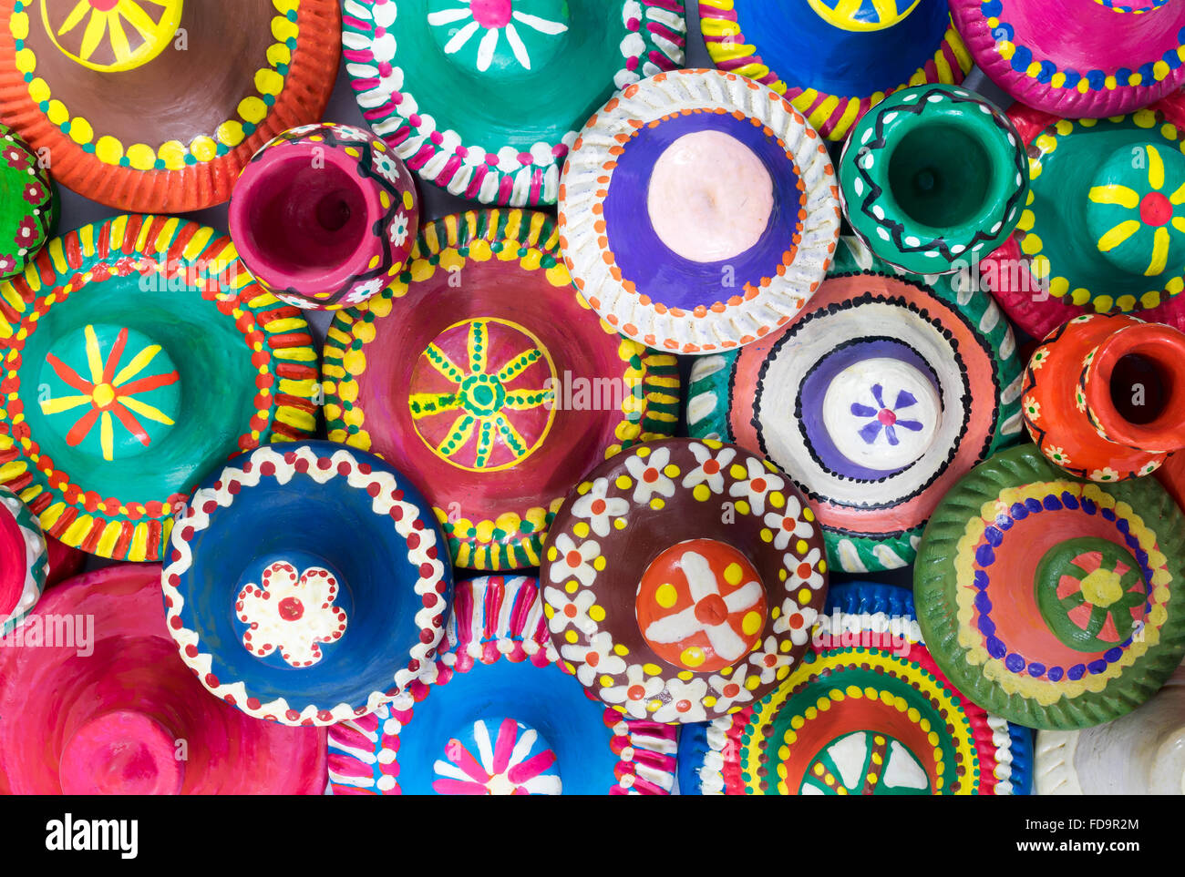A group of painted handmade pottery vessels top covers Stock Photo - Alamy