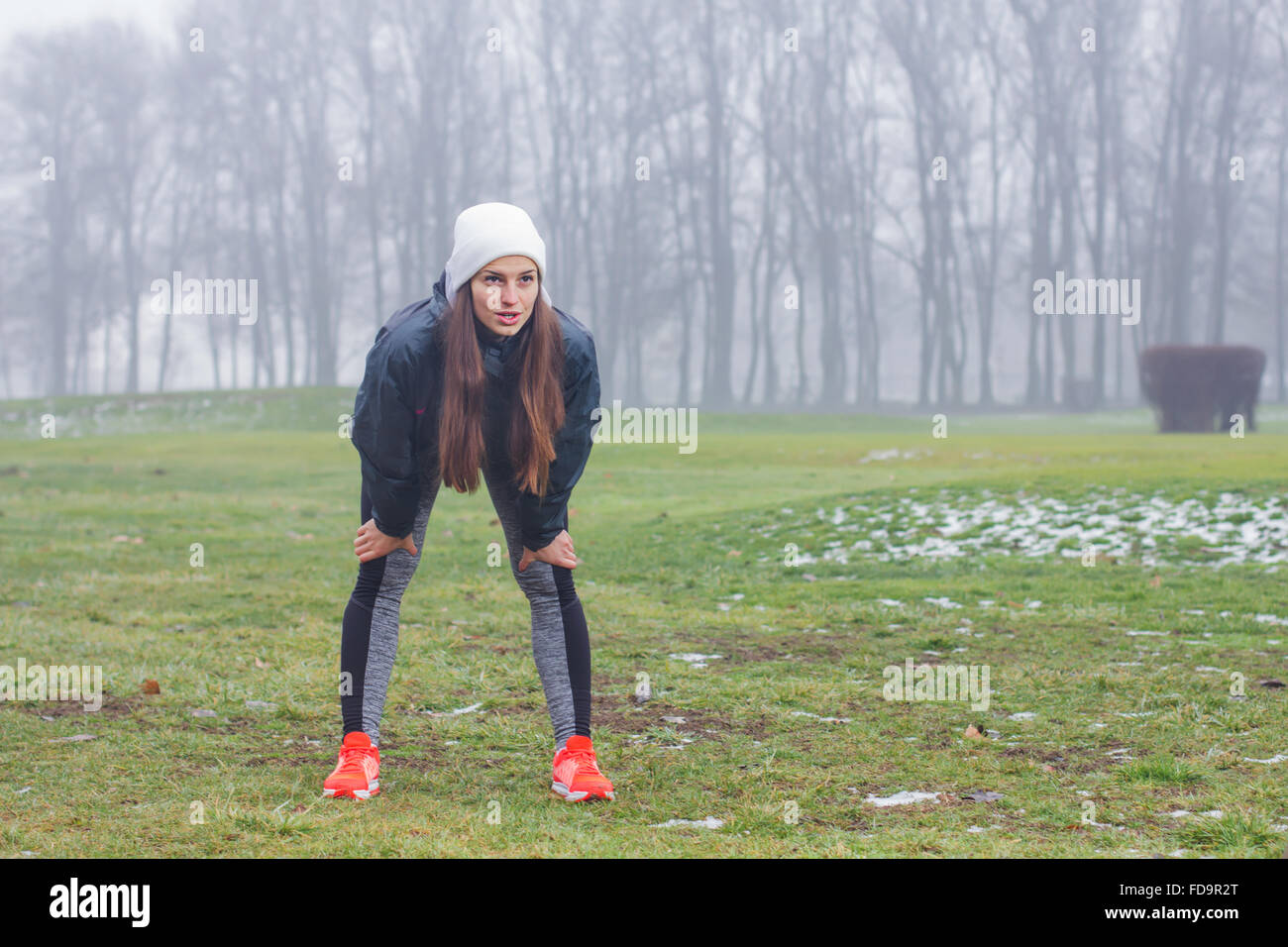 Fitness Woman relaxing after running in the park , healthy outdoor ...