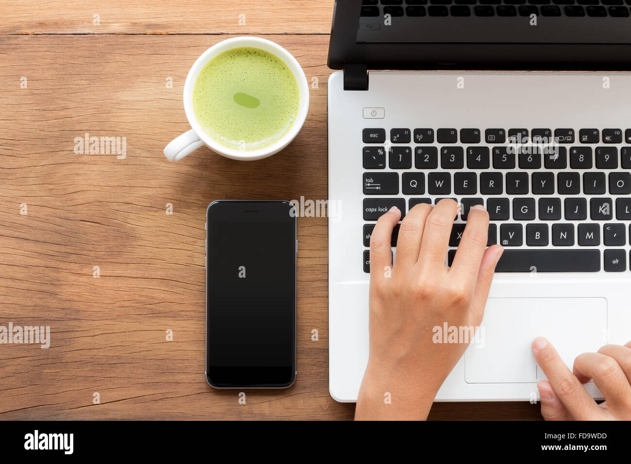 using laptop computer on workspace Stock Photo - Alamy