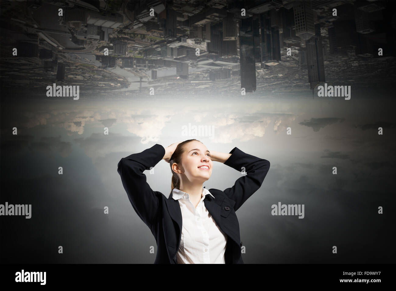 Young businesswoman with hands on head thinking something over Stock ...