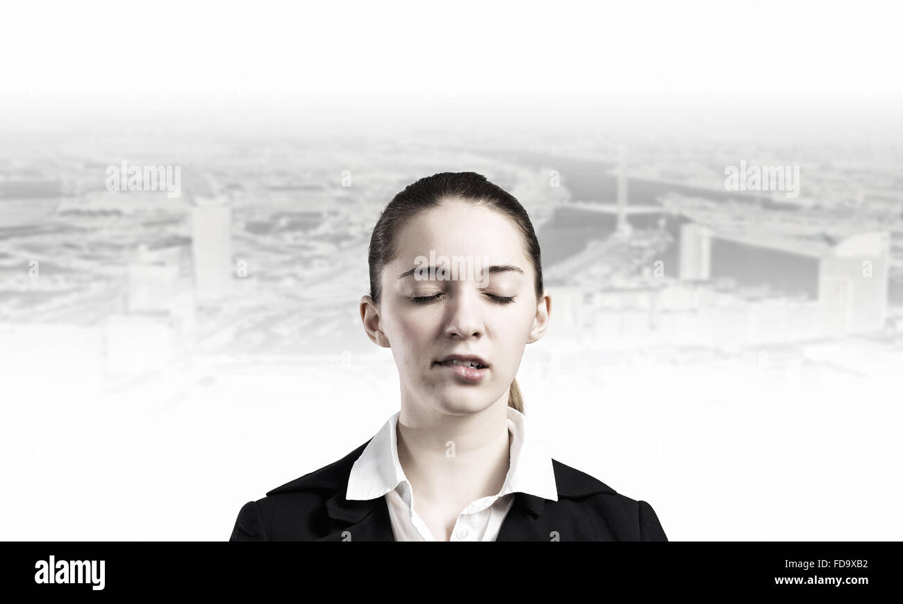 Young businesswoman with closed eyes thinking something over Stock ...