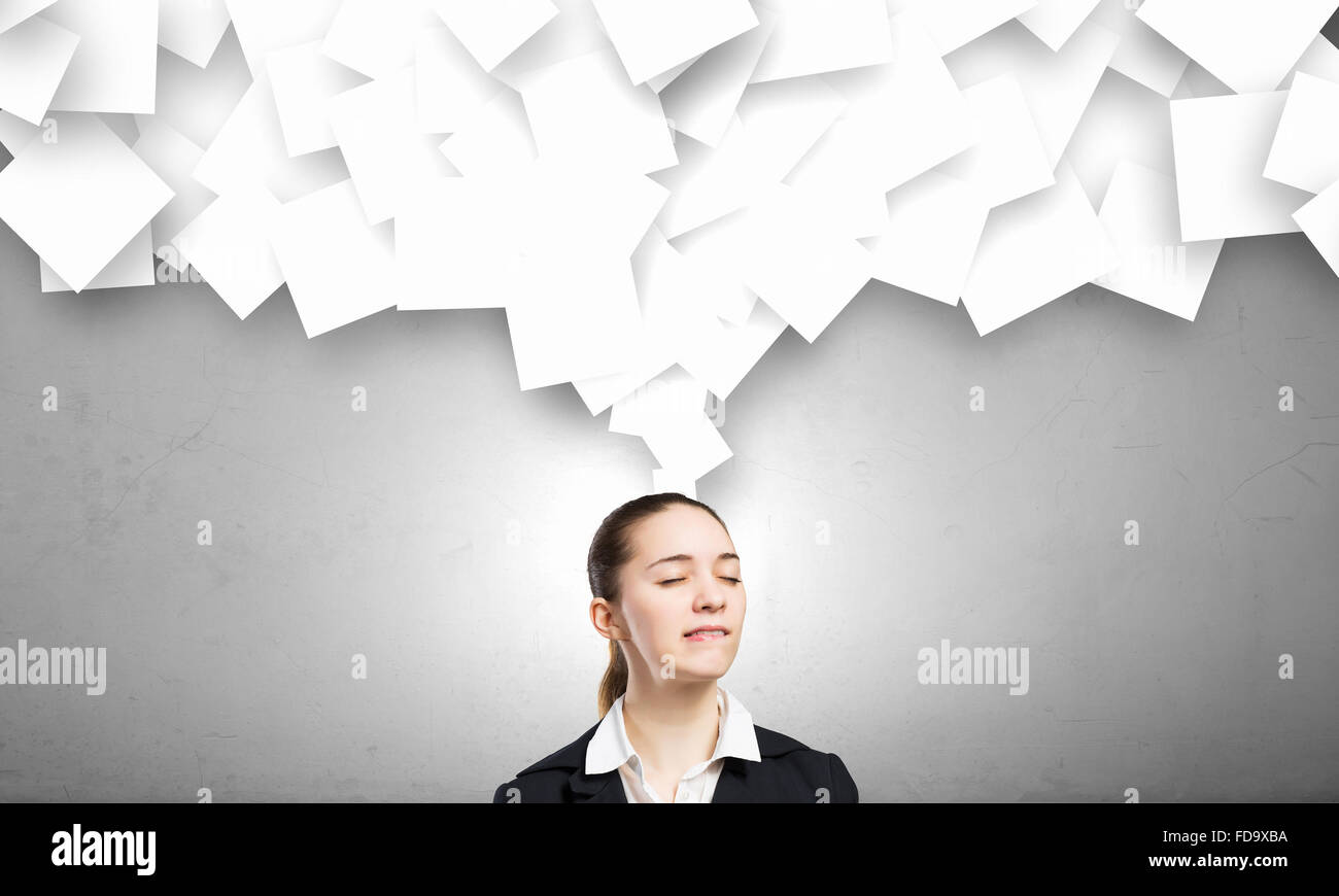 Young businesswoman with closed eyes thinking something over Stock ...