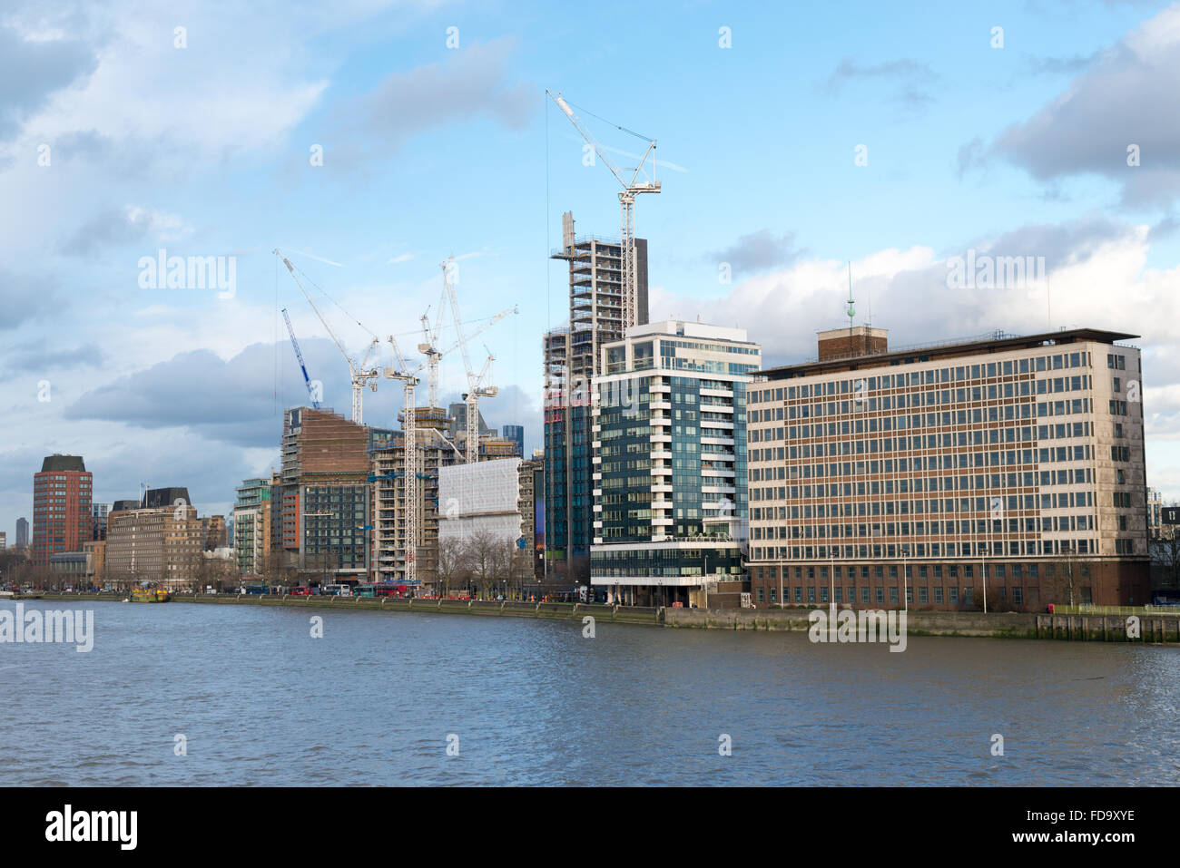 Tall buildings being built on the south side of the River Thames London ...