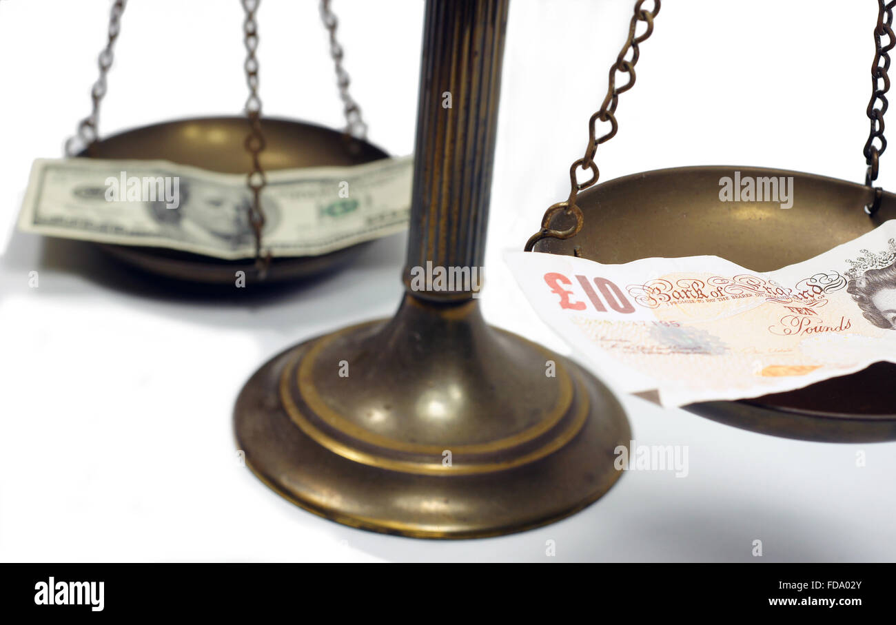 Dollar and Pound notes on scale Stock Photo - Alamy