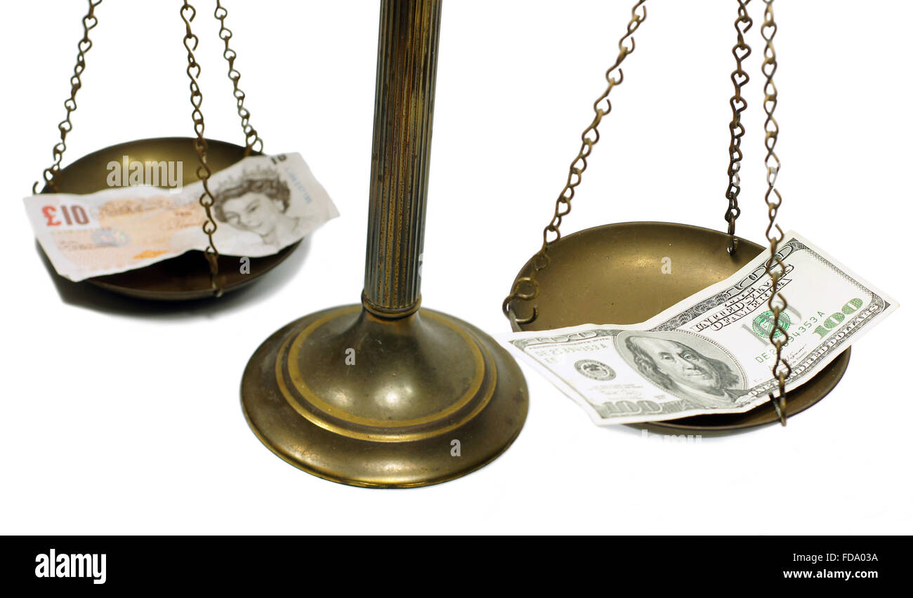 Dollar and Pound notes on scale Stock Photo - Alamy