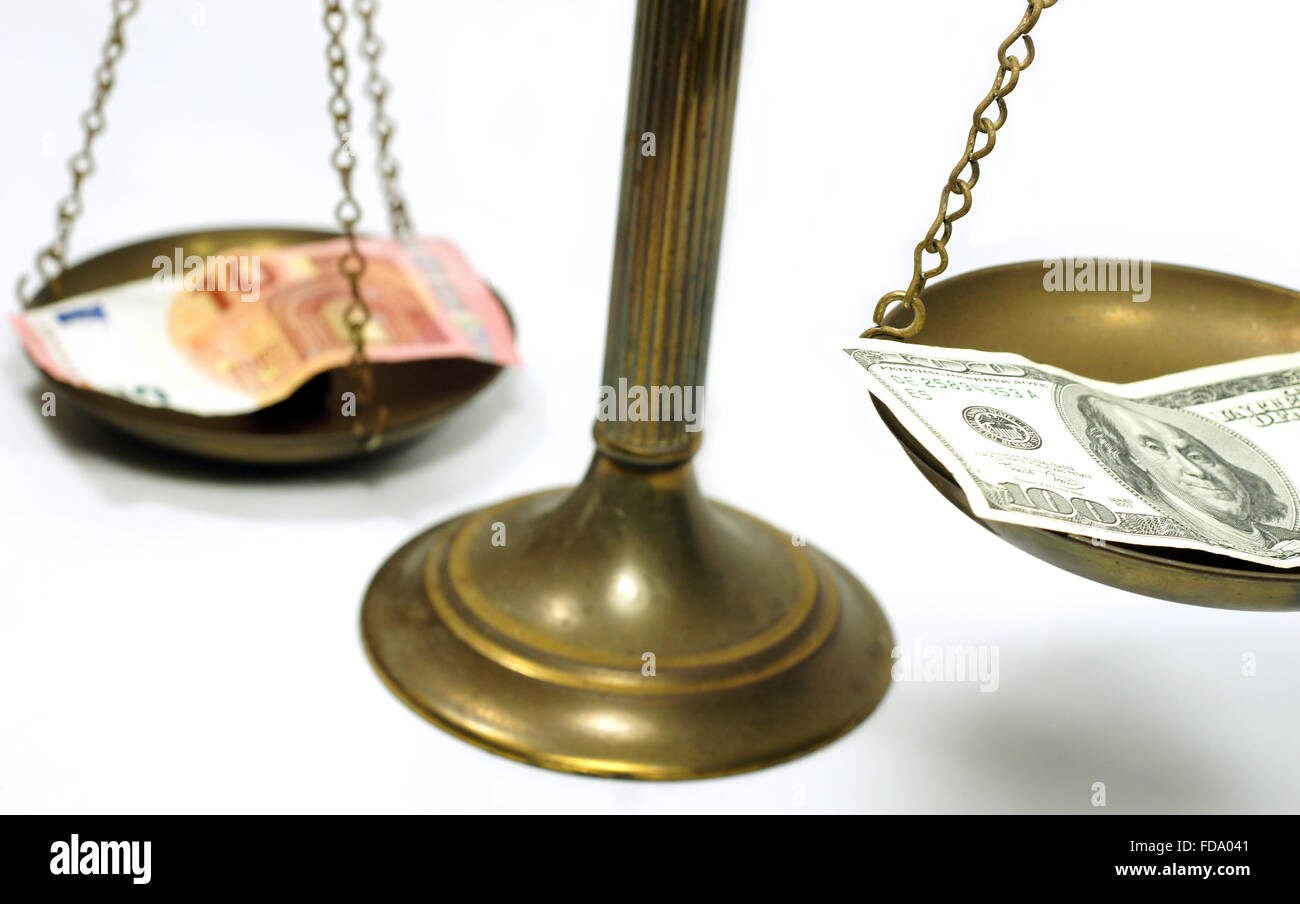 Dollar and Euro notes on scale Stock Photo - Alamy