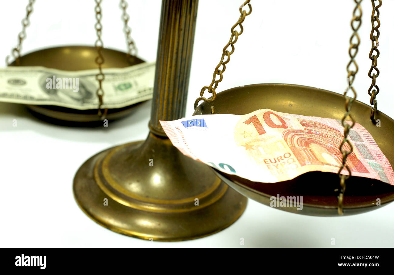 Dollar and Euro notes on scale Stock Photo - Alamy