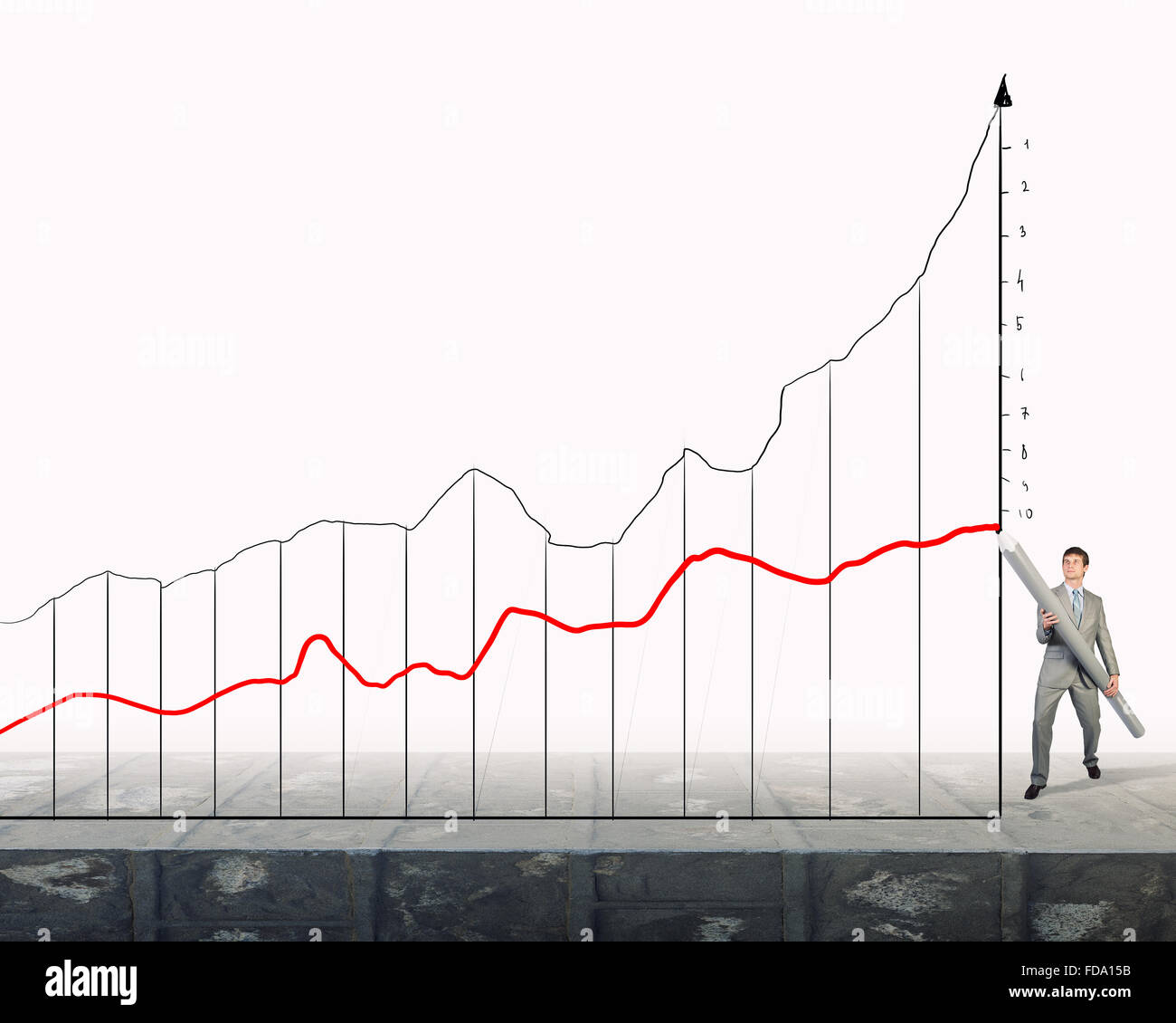 Businessman drawing growing graph with huge pencil Stock Photo - Alamy
