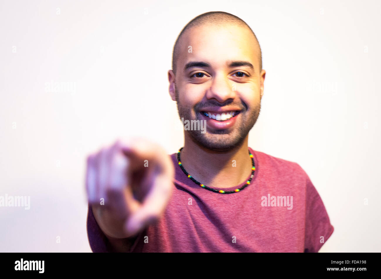 London comedian Sam Smedley smiling and pointing Stock Photo - Alamy