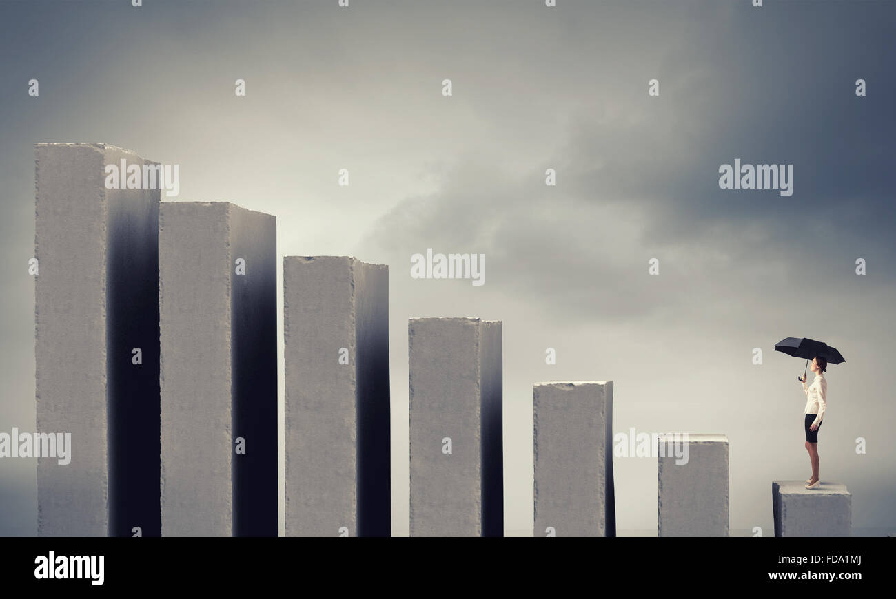 Young businesswoman with black umbrella standing on falling graph Stock ...