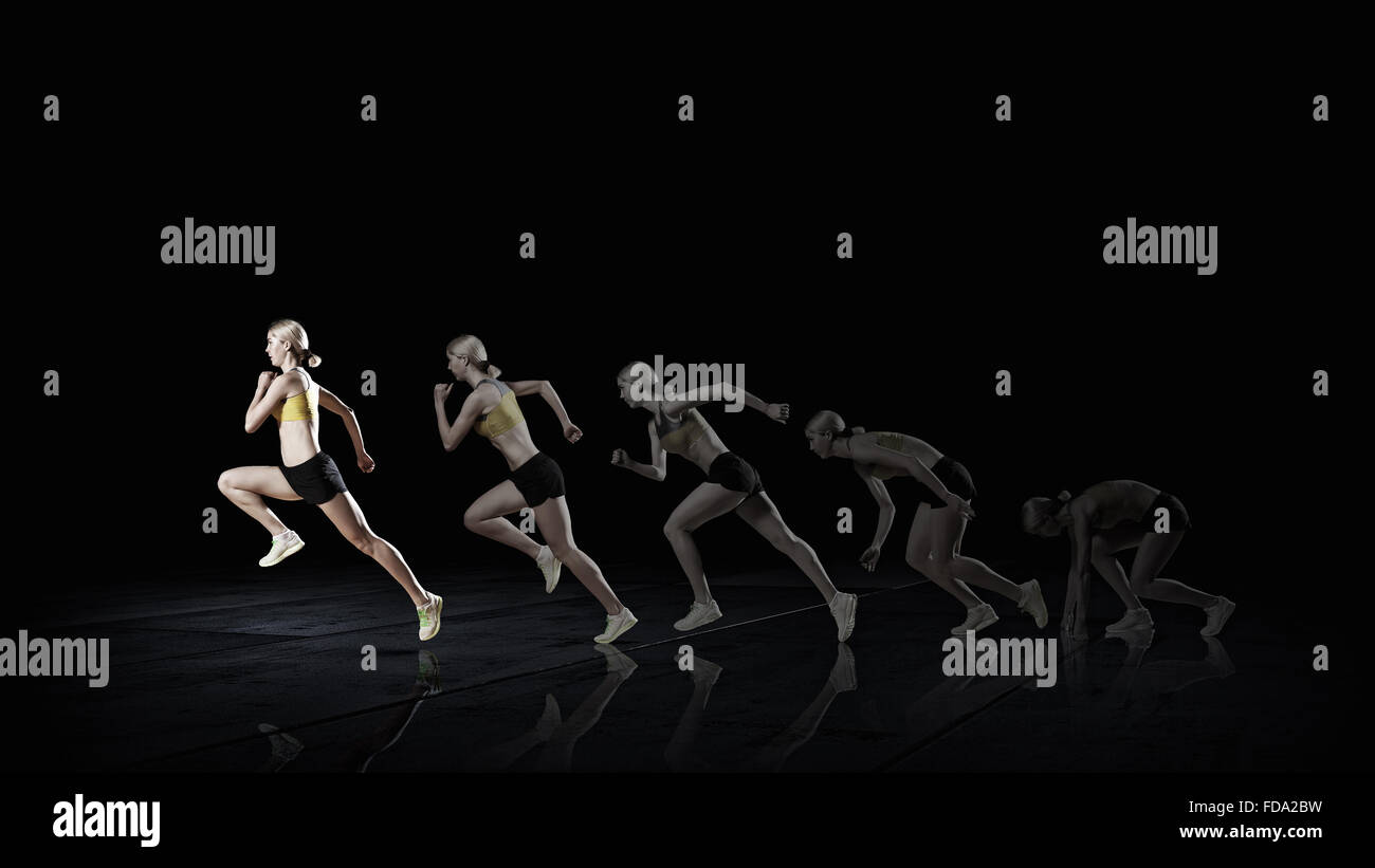 Young woman athlete running fast on dark background Stock Photo - Alamy