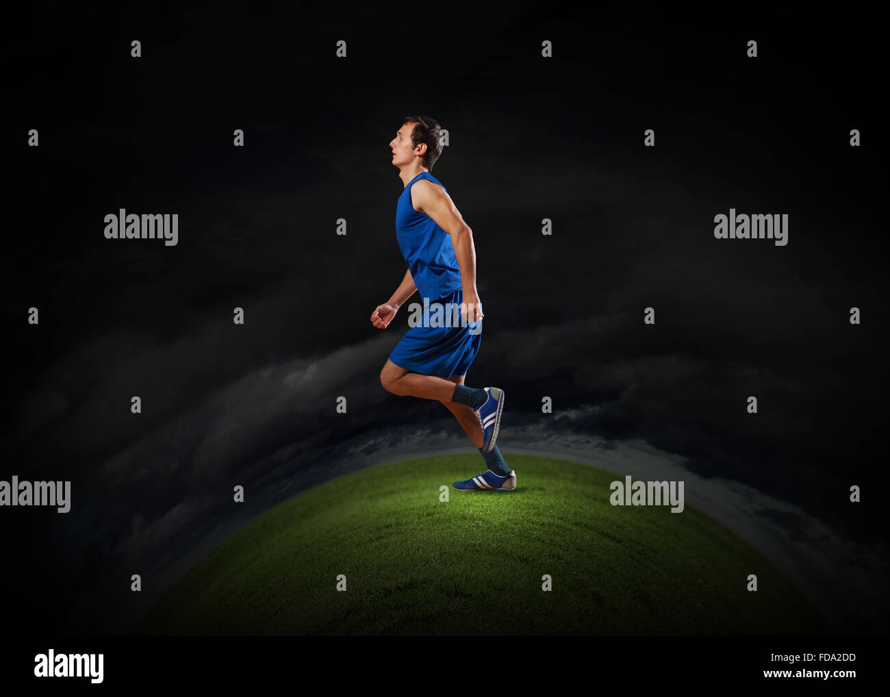 Young running man athlete in blue wear Stock Photo - Alamy