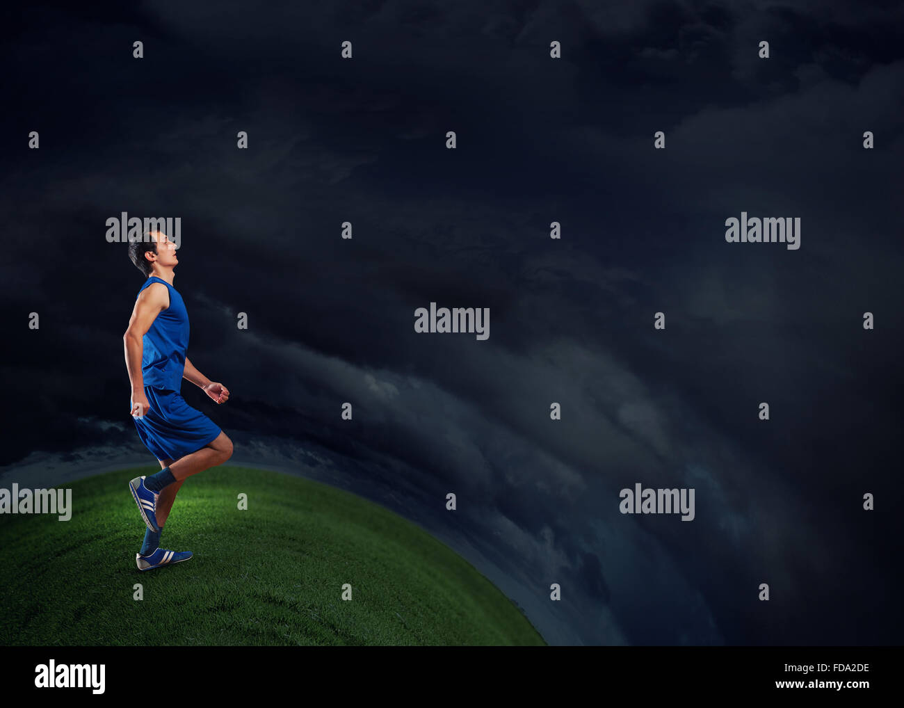 Young running man athlete in blue wear Stock Photo - Alamy