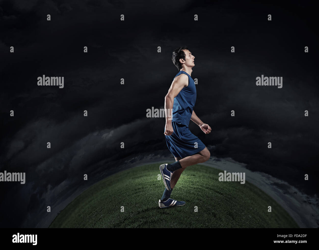 Young running man athlete in blue wear Stock Photo - Alamy