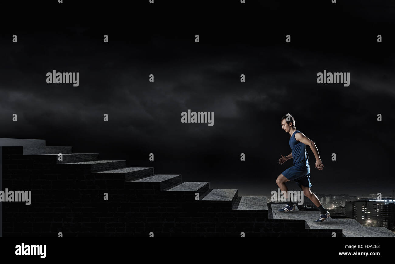 Young man athlete in blue wear running outdoor Stock Photo - Alamy