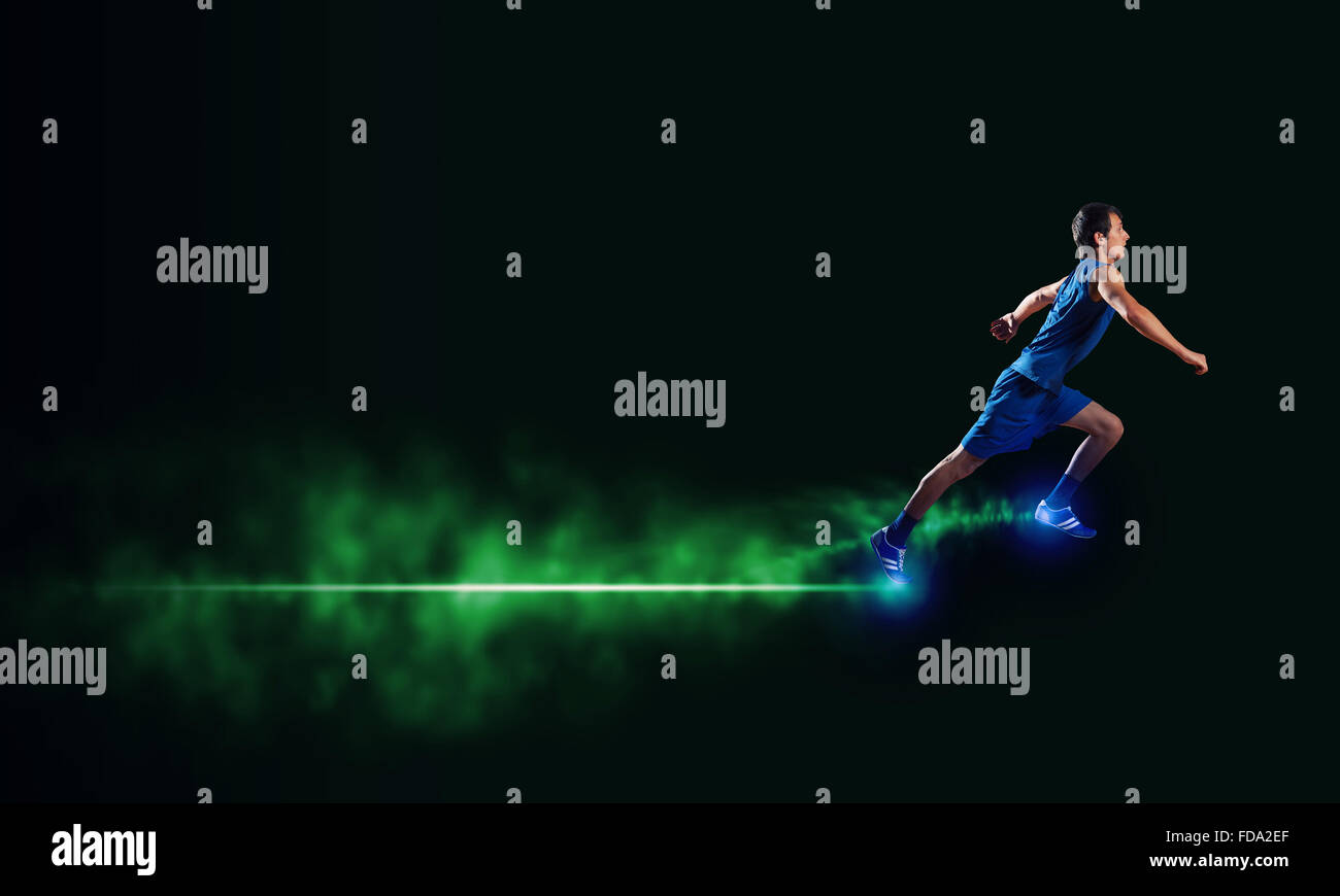 Young running man athlete in blue wear Stock Photo - Alamy