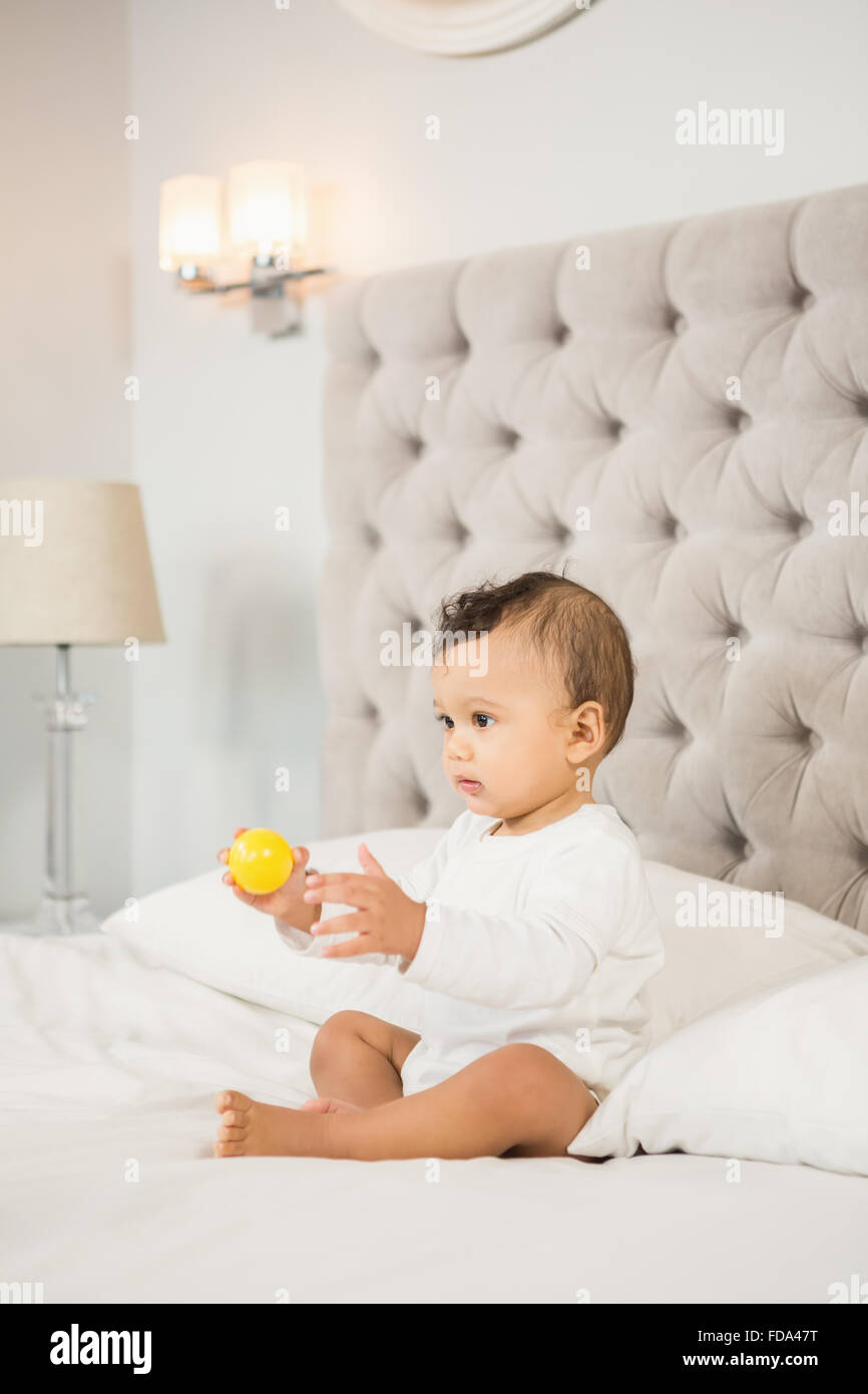 Cute baby playing with ball Stock Photo - Alamy