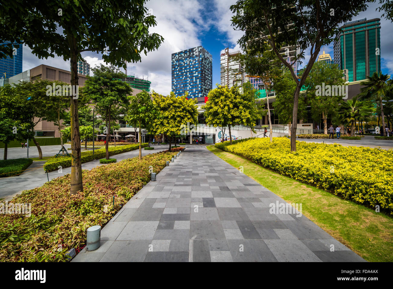 Walkway at a park and skyscrapers at Bonifacio Global City, in Taguig ...