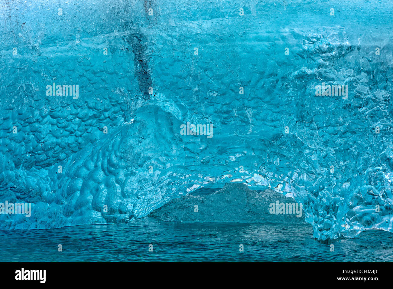 Blue iceberg in the Jökulsárlón glacier lagoon, Detail, Southern Region ...