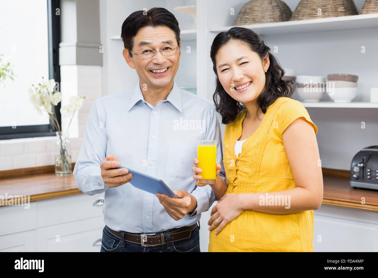 Happy expectant couple using hi-res stock photography and images - Alamy