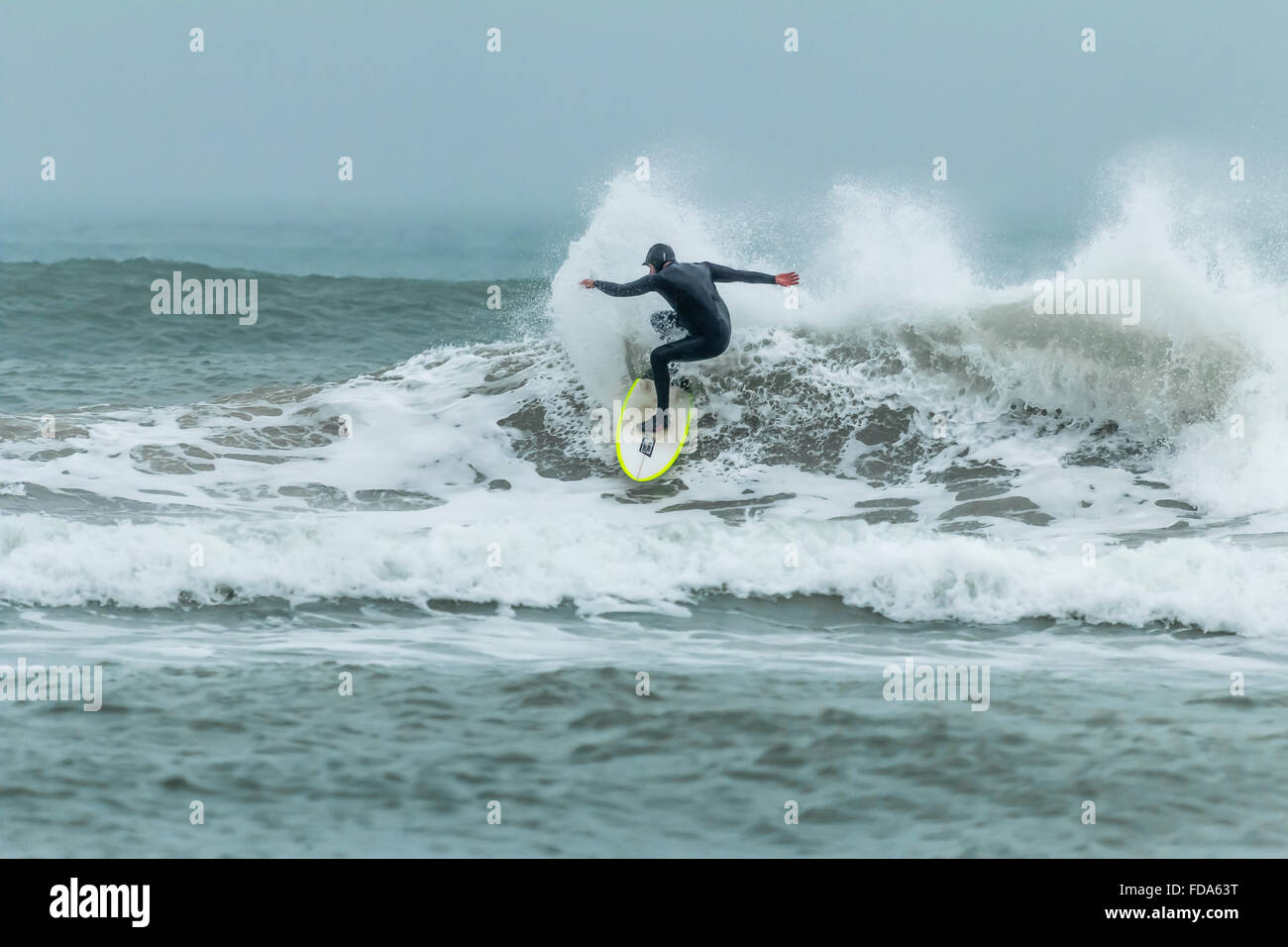 All action surfing, Fistral Beach, Cornwall, UK Stock Photo - Alamy