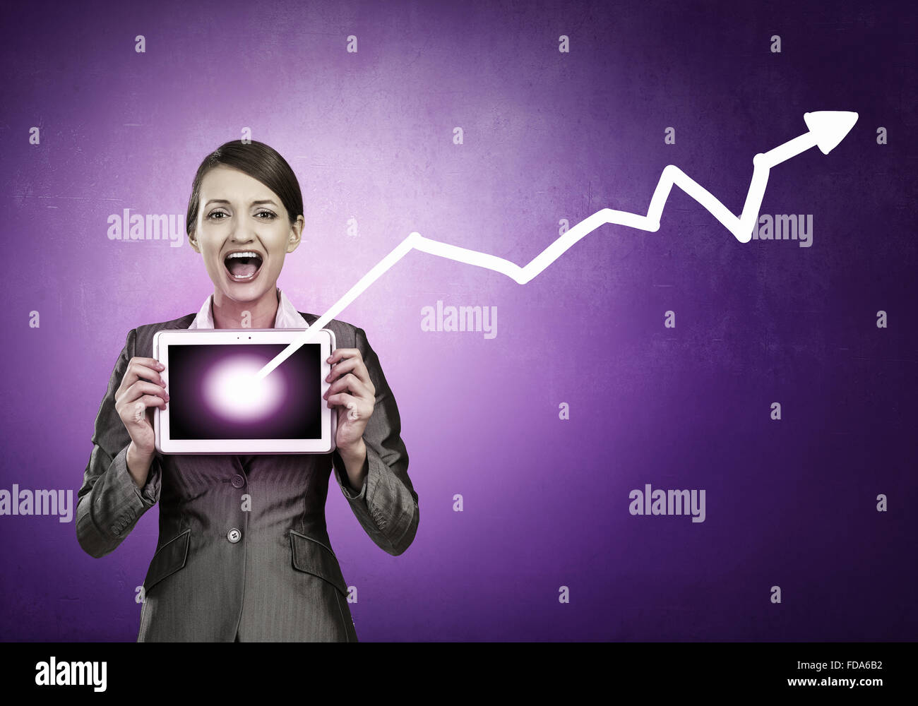 Beautiful young woman holding tablet pc with graph against her chest ...