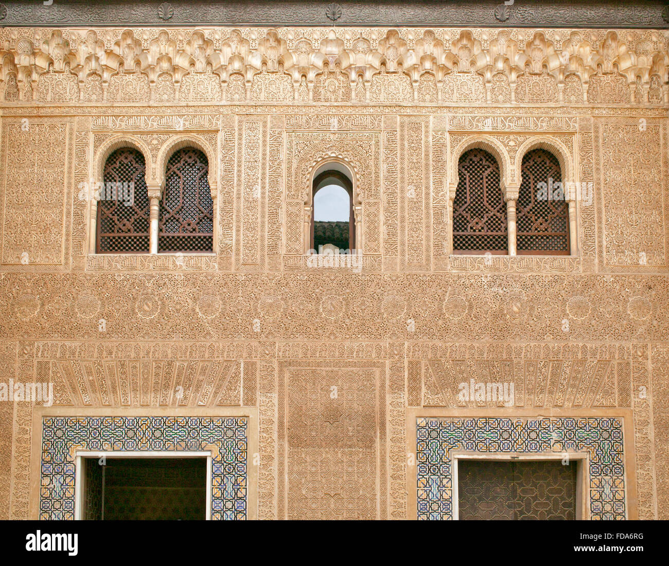 GRANADA ANDALUCIA SPAIN THE ALHAMBRA INTERIOR WALL WITH WINDOWS AND TILED DOORWAYS WITH WALLS ...