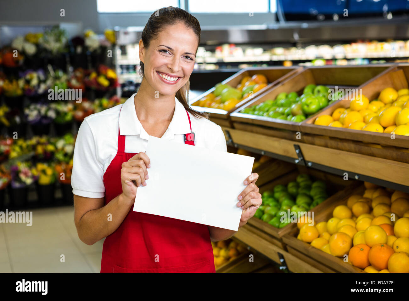 Female worker holding blank sign Stock Photo - Alamy
