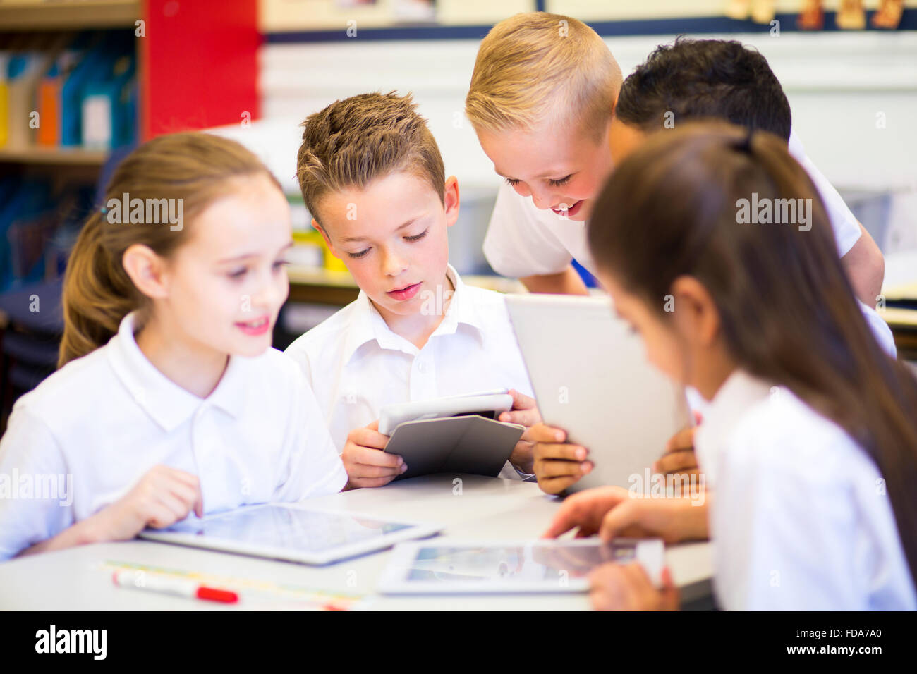 Happy students wearing school uniforms hi-res stock photography and ...