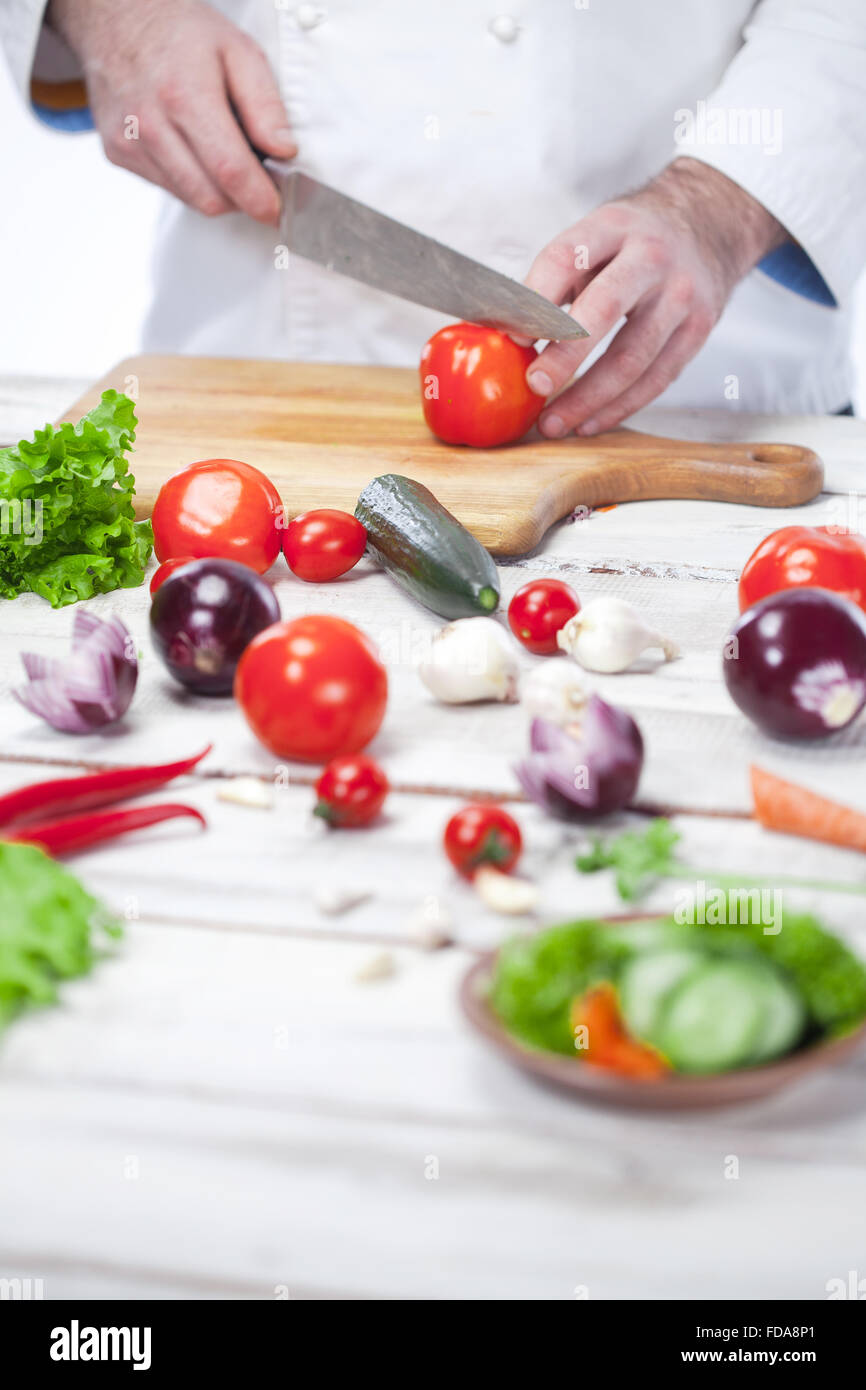 Professional chef cutting tomato hi-res stock photography and images ...