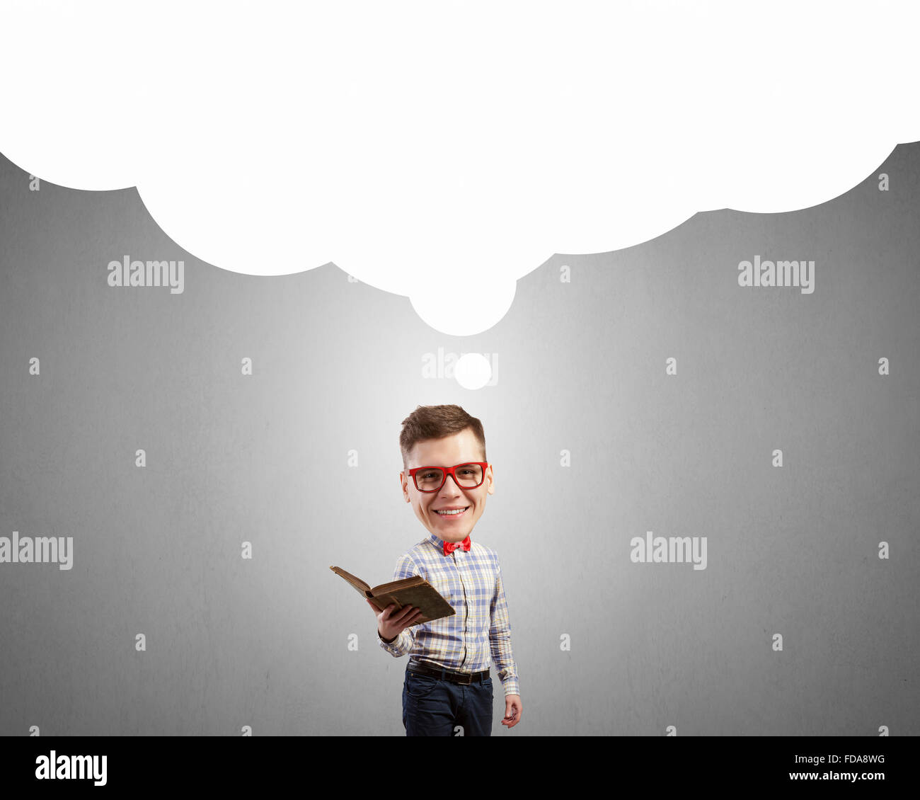 Young funny big headed man in glasses with book in hands Stock Photo ...