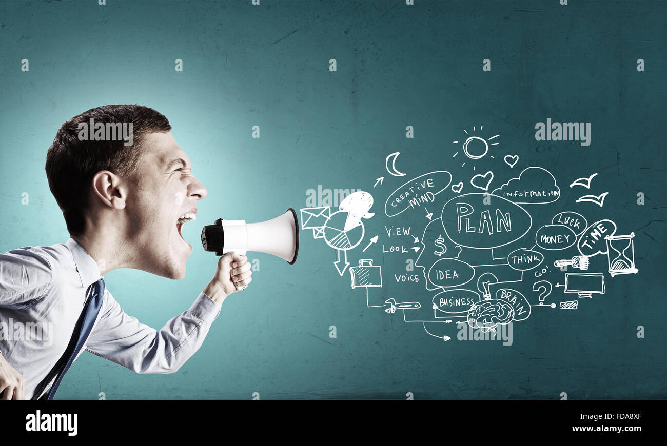 Funny young man with big head screaming emotionally in megaphone Stock ...