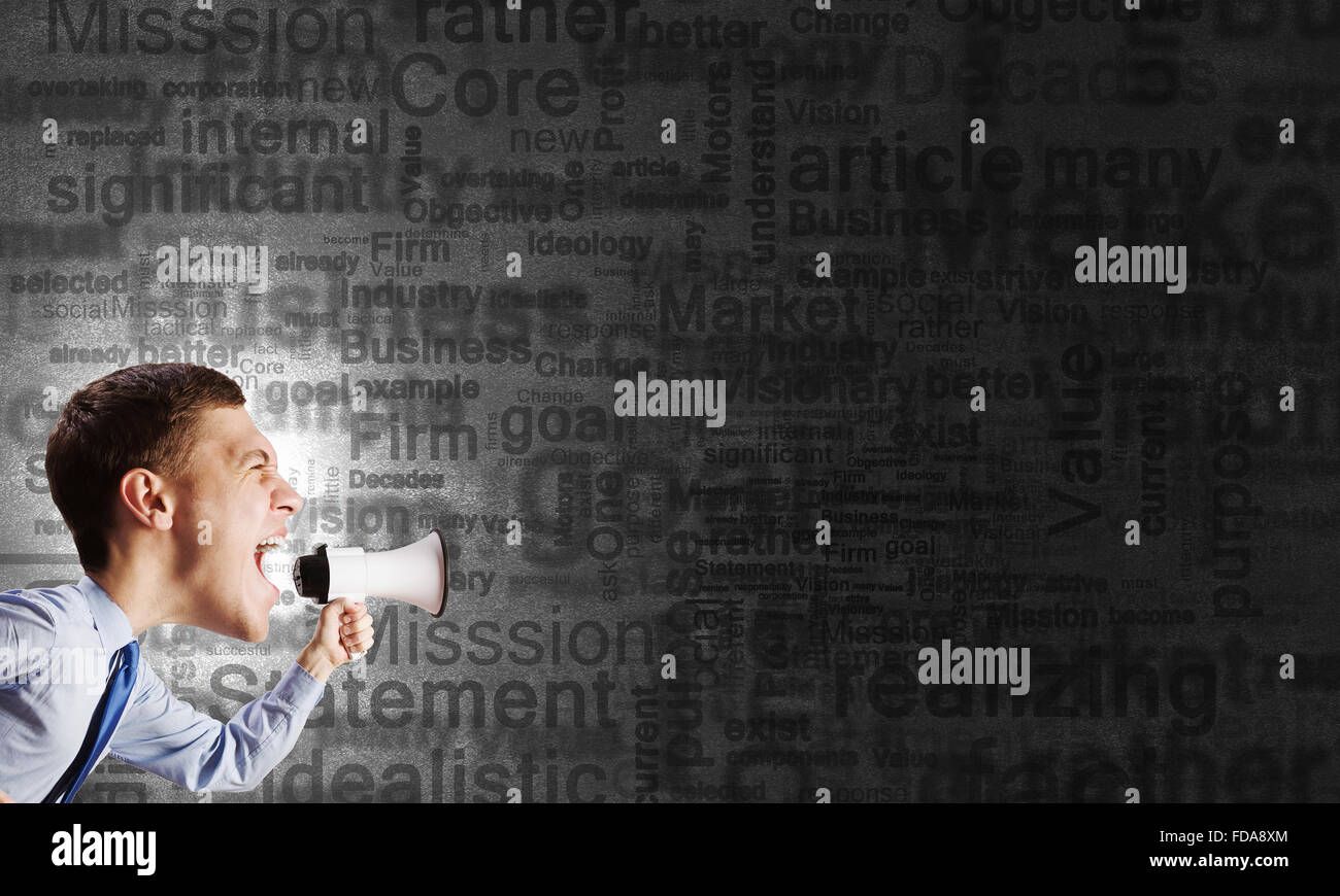 Funny young man with big head screaming emotionally in megaphone Stock ...