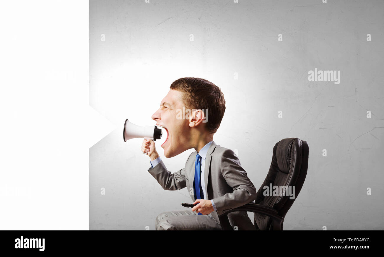Funny young man with big head screaming emotionally in megaphone Stock ...