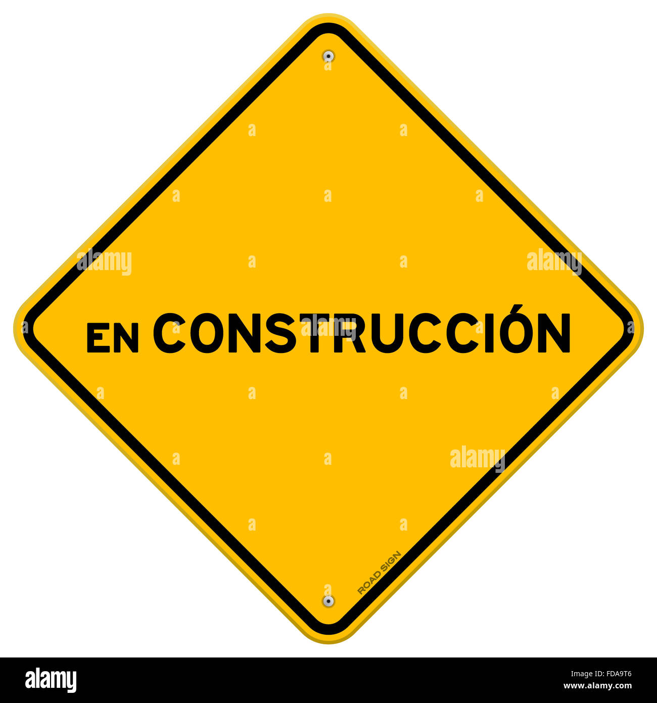 Isolated single en construccion sign Stock Photo - Alamy