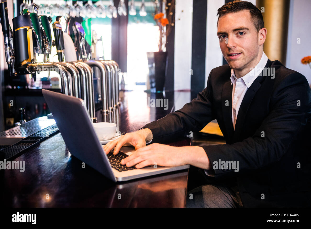 Businessman using laptop Stock Photo - Alamy