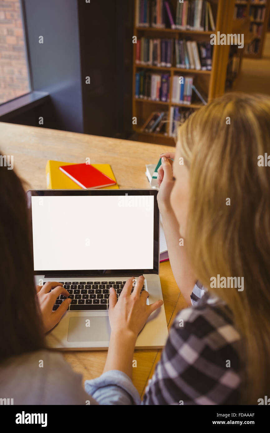 Rear view of students using laptop Stock Photo - Alamy