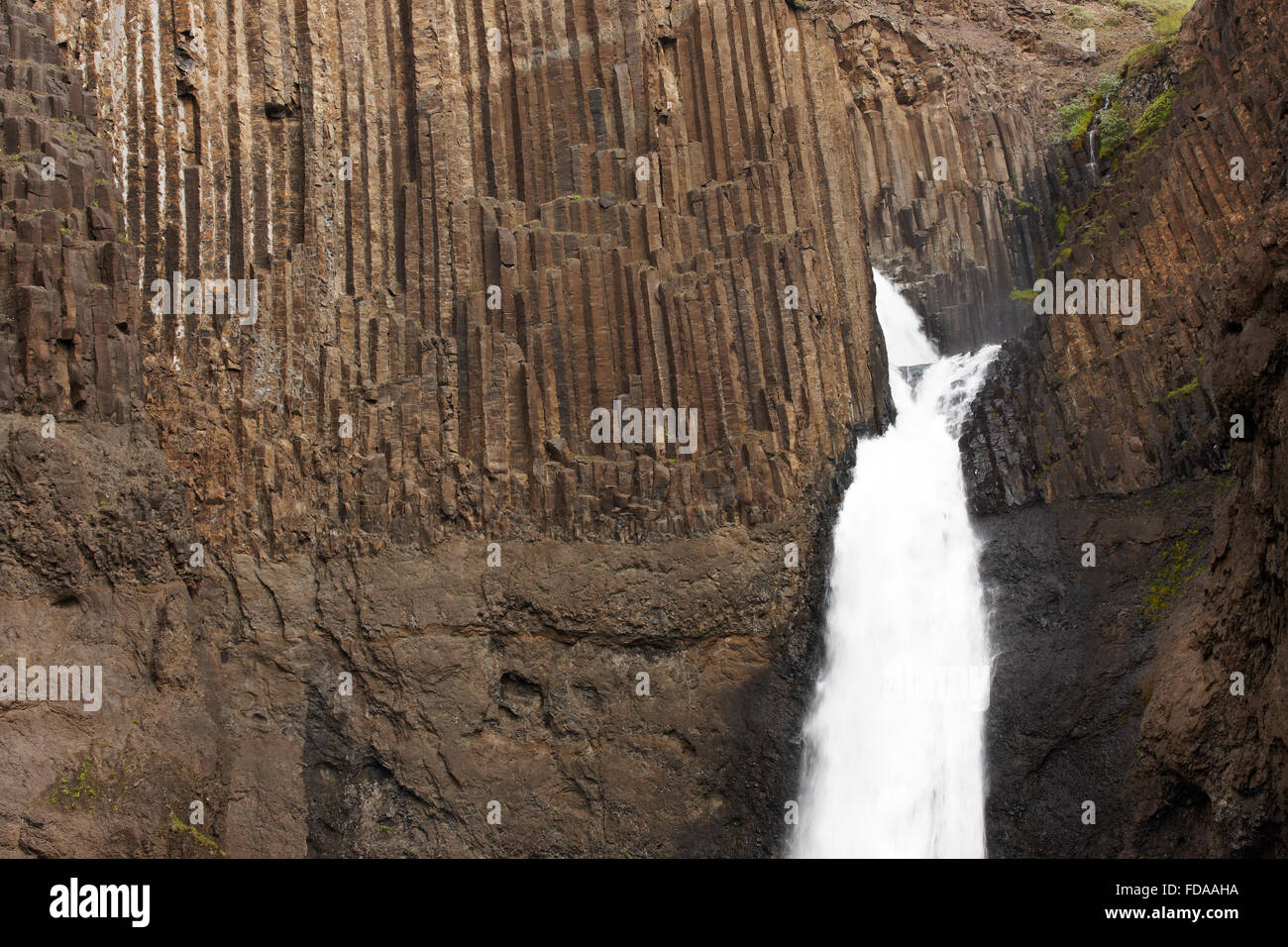 Icelandic landscape with waterfall and basaltic formations Stock Photo ...