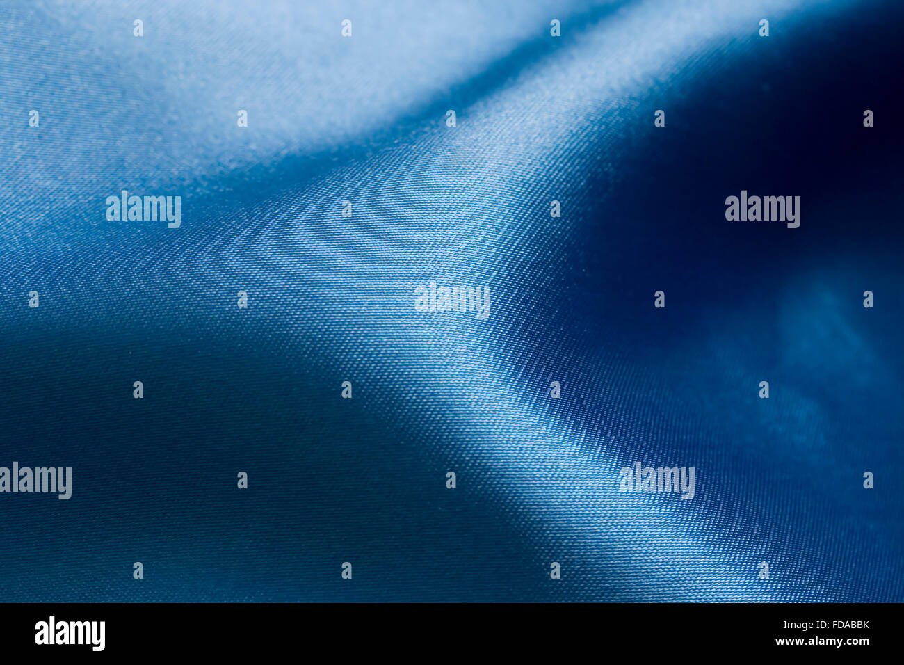 Soft blue satin fabric backdrop Stock Photo - Alamy