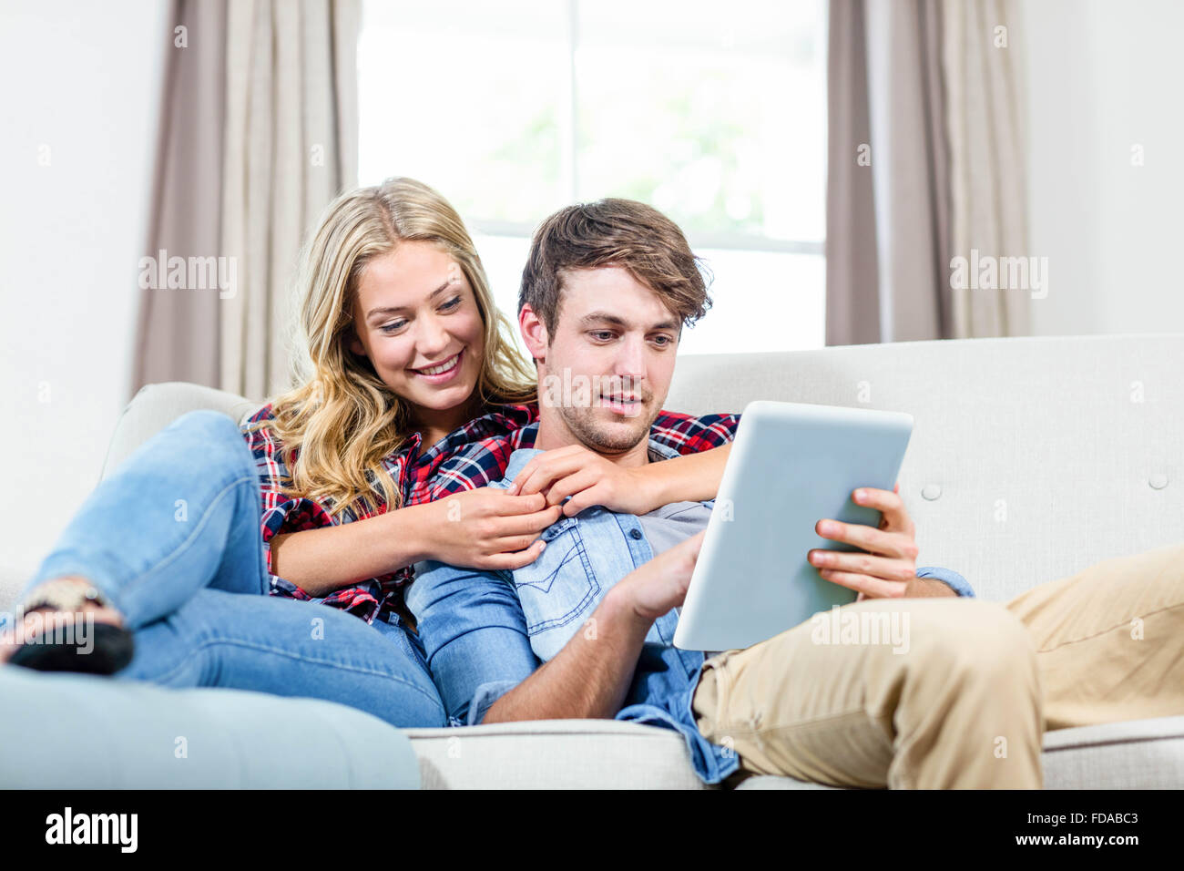 Couple using tablet computer Stock Photo - Alamy