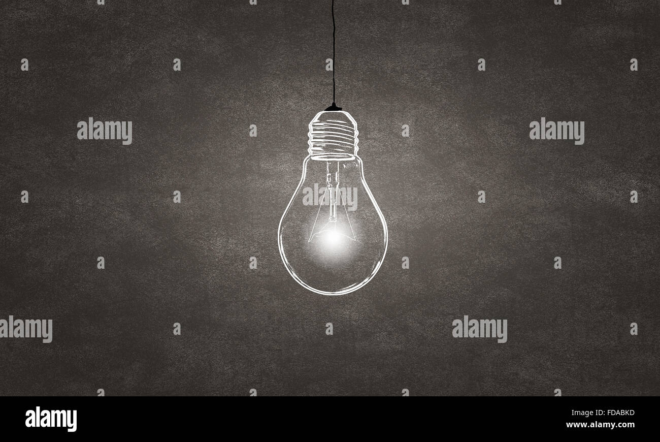 Glowing light bulb on dark background hanging from above Stock Photo ...