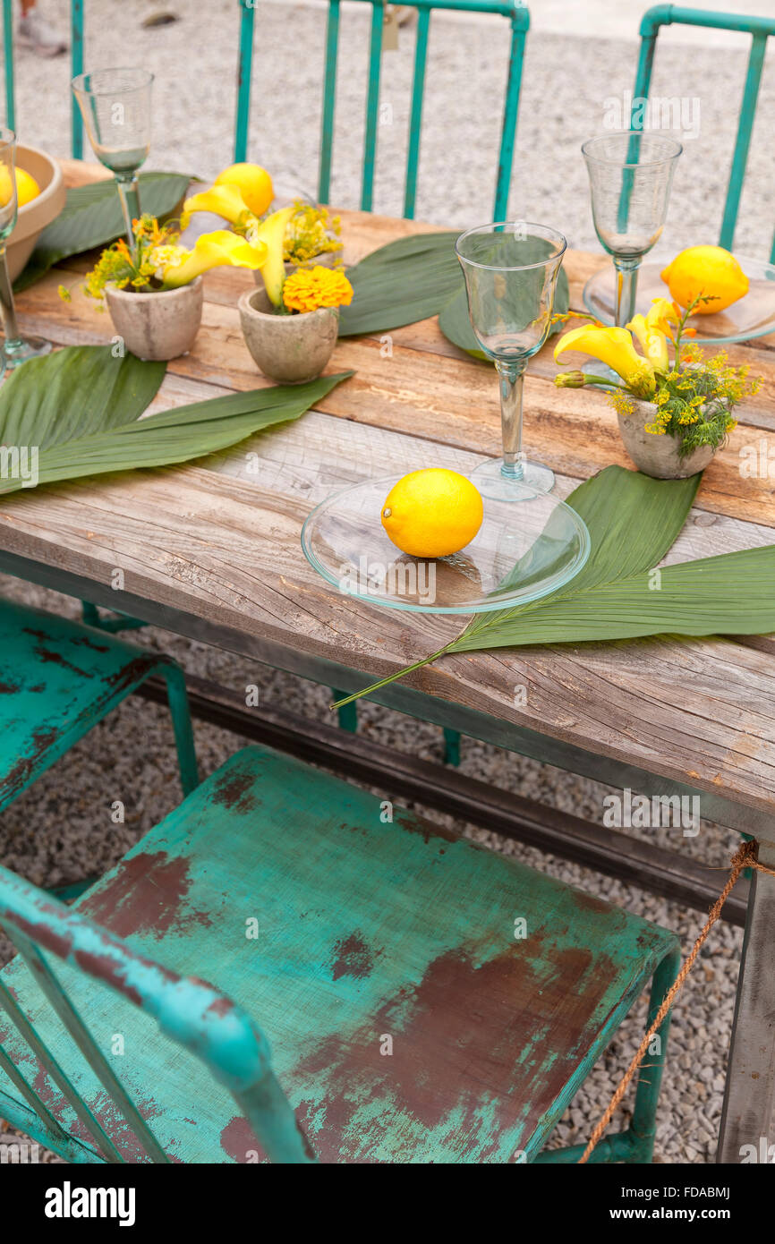 Image of a rustic table dinner setting in the garden Stock Photo - Alamy
